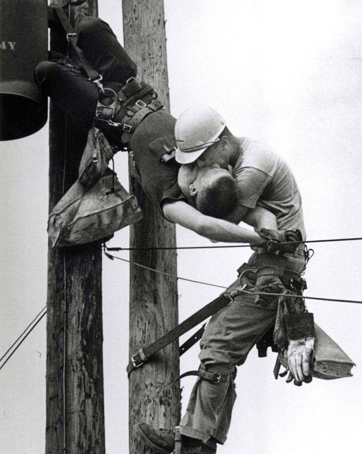 The Kiss of Life - A utility worker giving mouth-to-mouth to co-worker ...